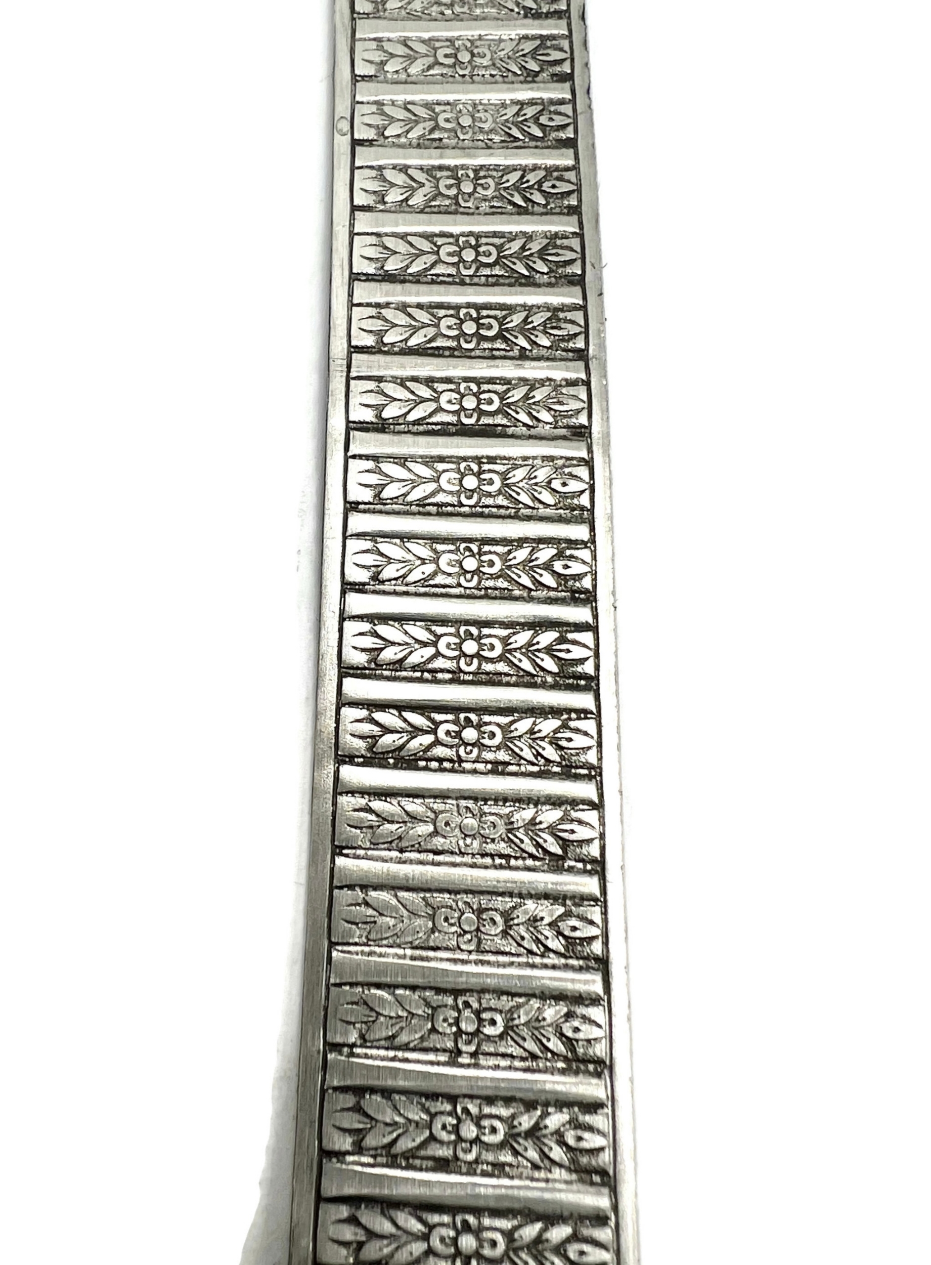 Potter USA - Fine Tools. Repeating Floral Motif Silver